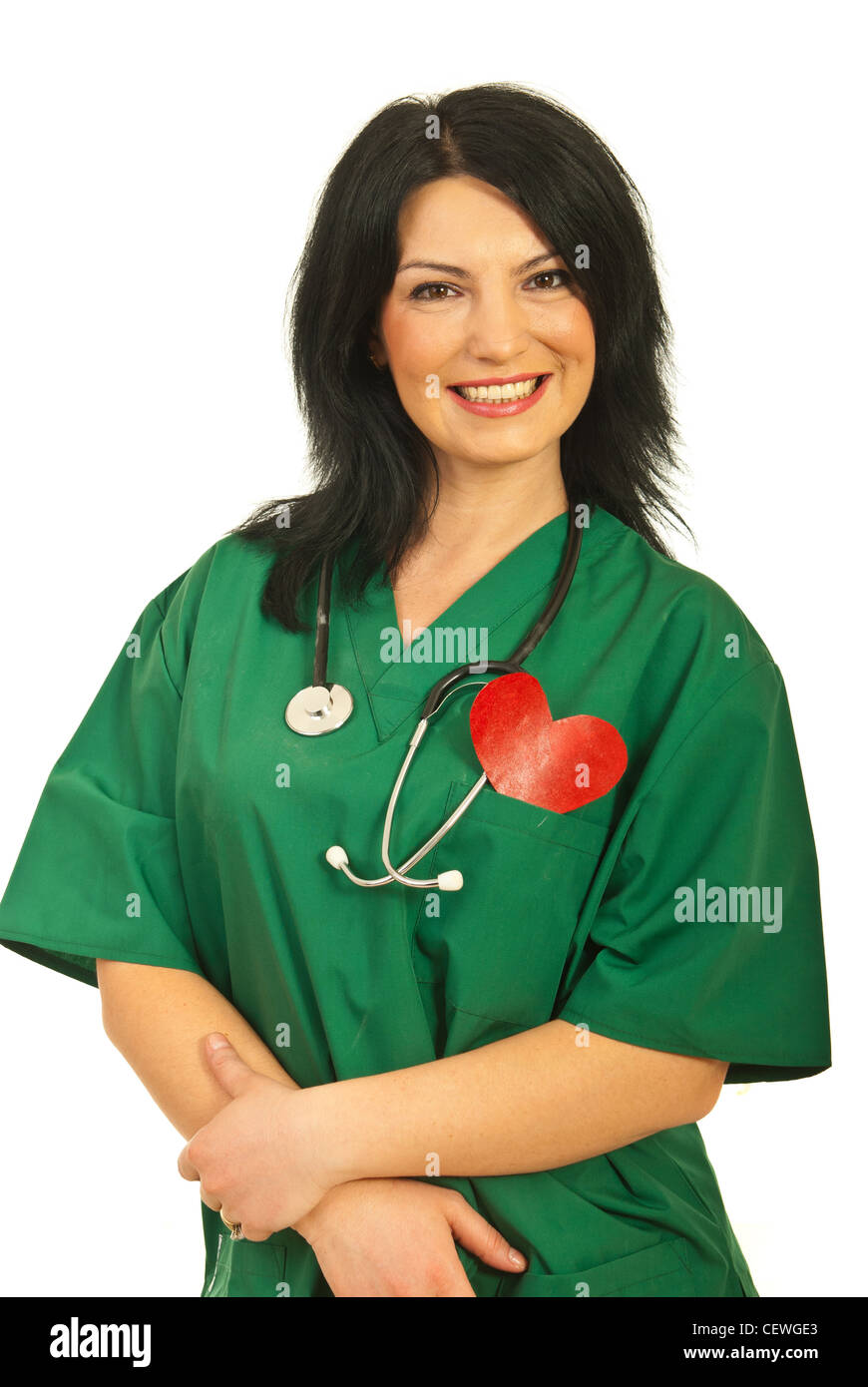Cheerful health worker woman smiling and holding a heart shape in her ...