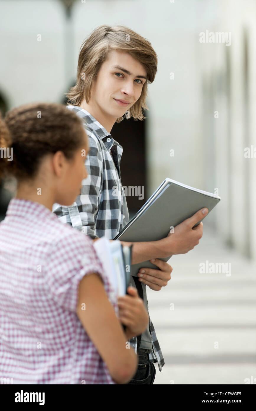 Young man on university campus Stock Photo - Alamy