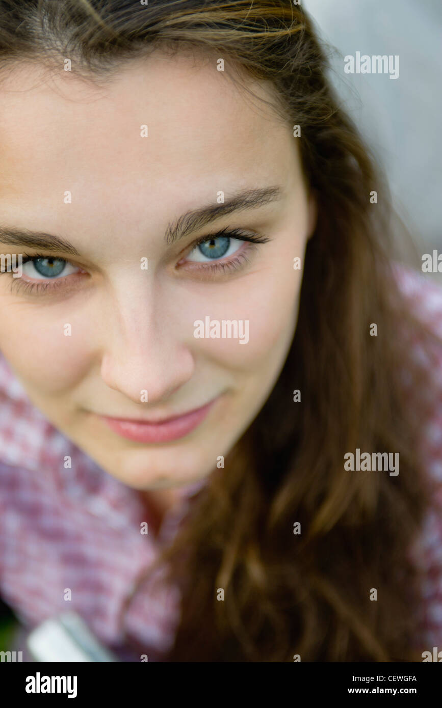 Young woman looking up at camera, portrait Stock Photo - Alamy