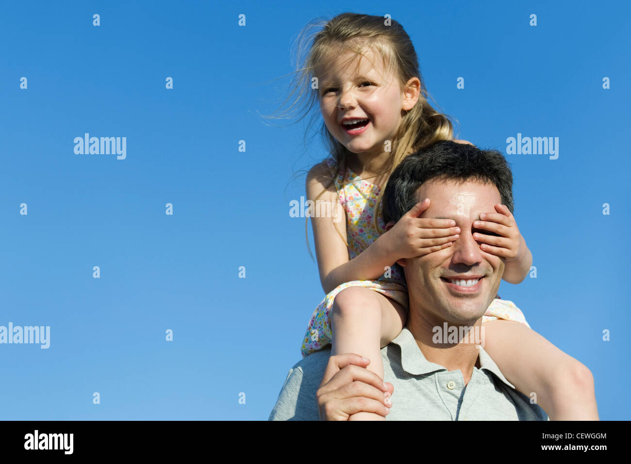 Children covering parents eyes hi-res stock photography and images - Alamy