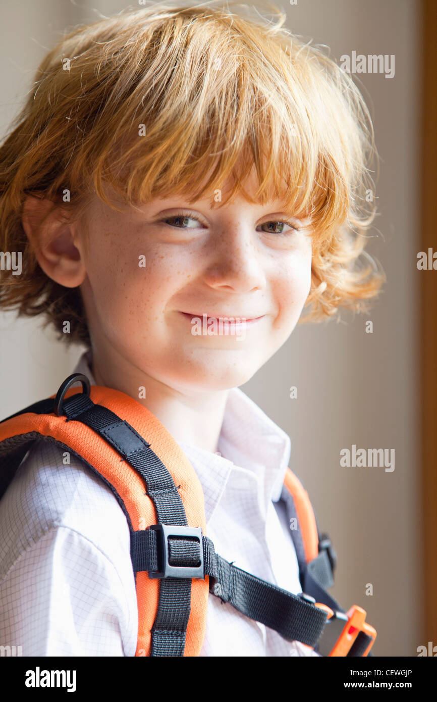 Little boy wearing backpack, portrait Stock Photo - Alamy