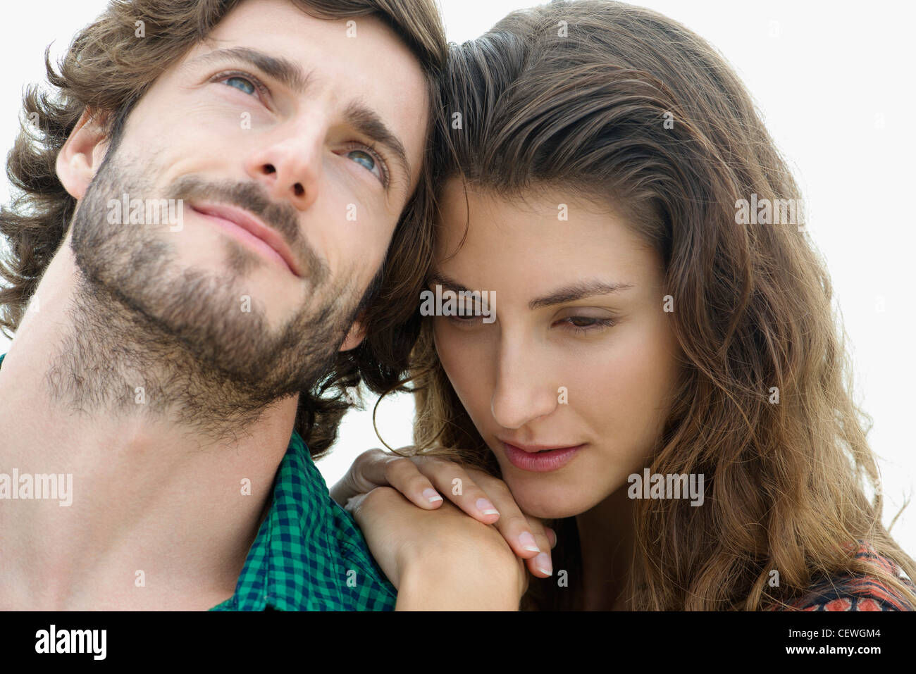 Young woman putting hands on young man's shoulder Stock Photo - Alamy