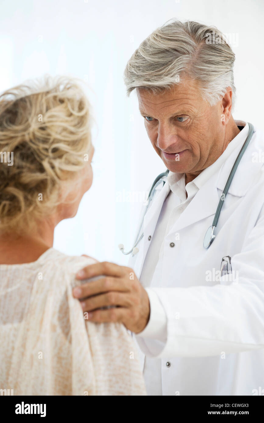 Doctor comforting patient Stock Photo - Alamy