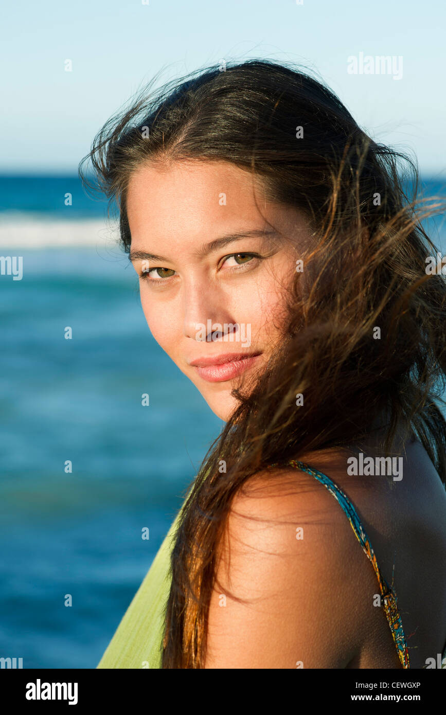 Young woman by sea, portrait Stock Photo - Alamy