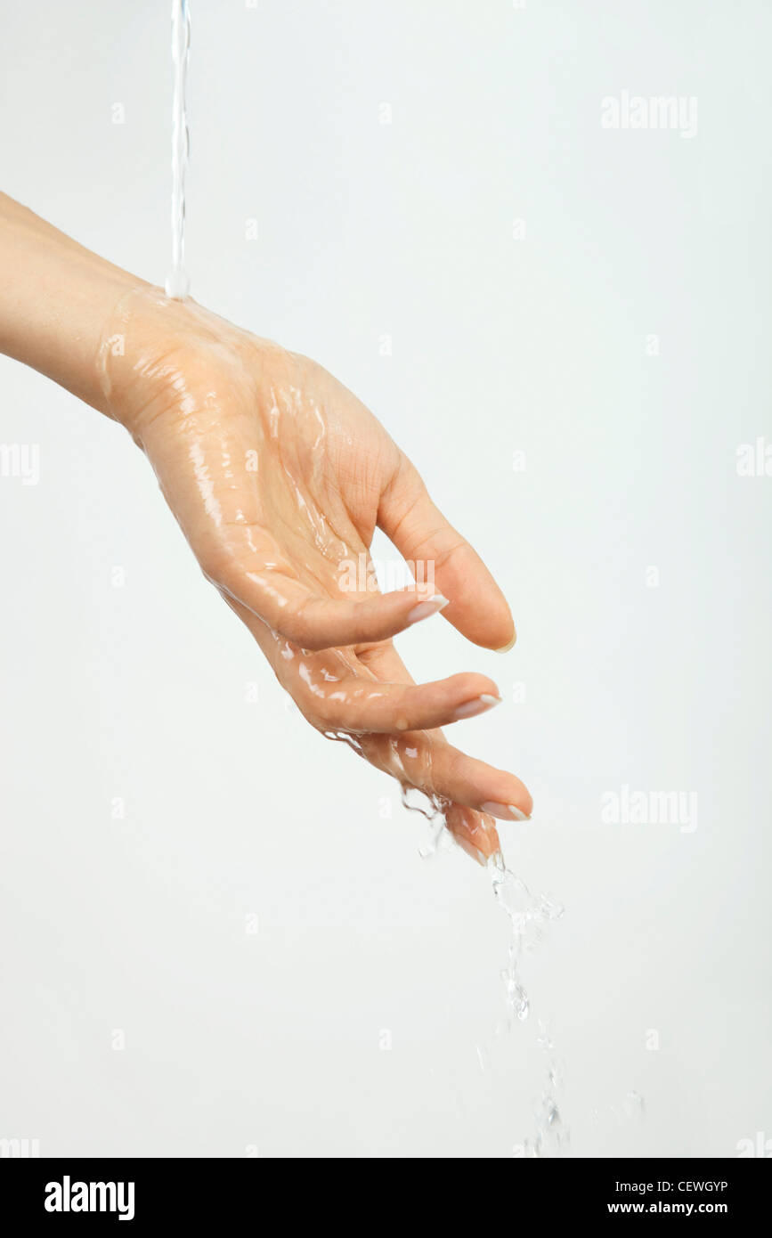 Hand under running water Stock Photo - Alamy
