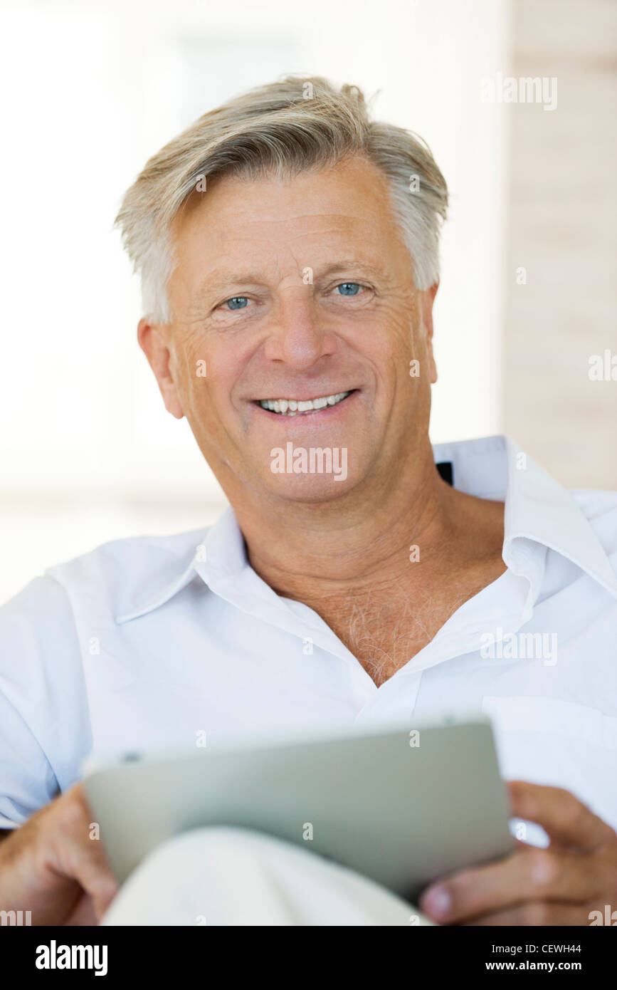 Man using digital tablet, portrait Stock Photo - Alamy