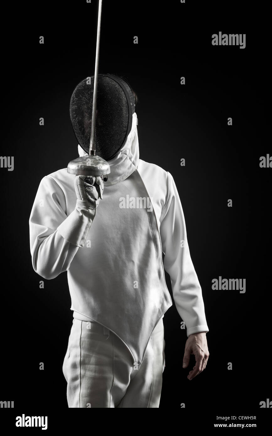 Fencer holding up foil, portrait Stock Photo - Alamy