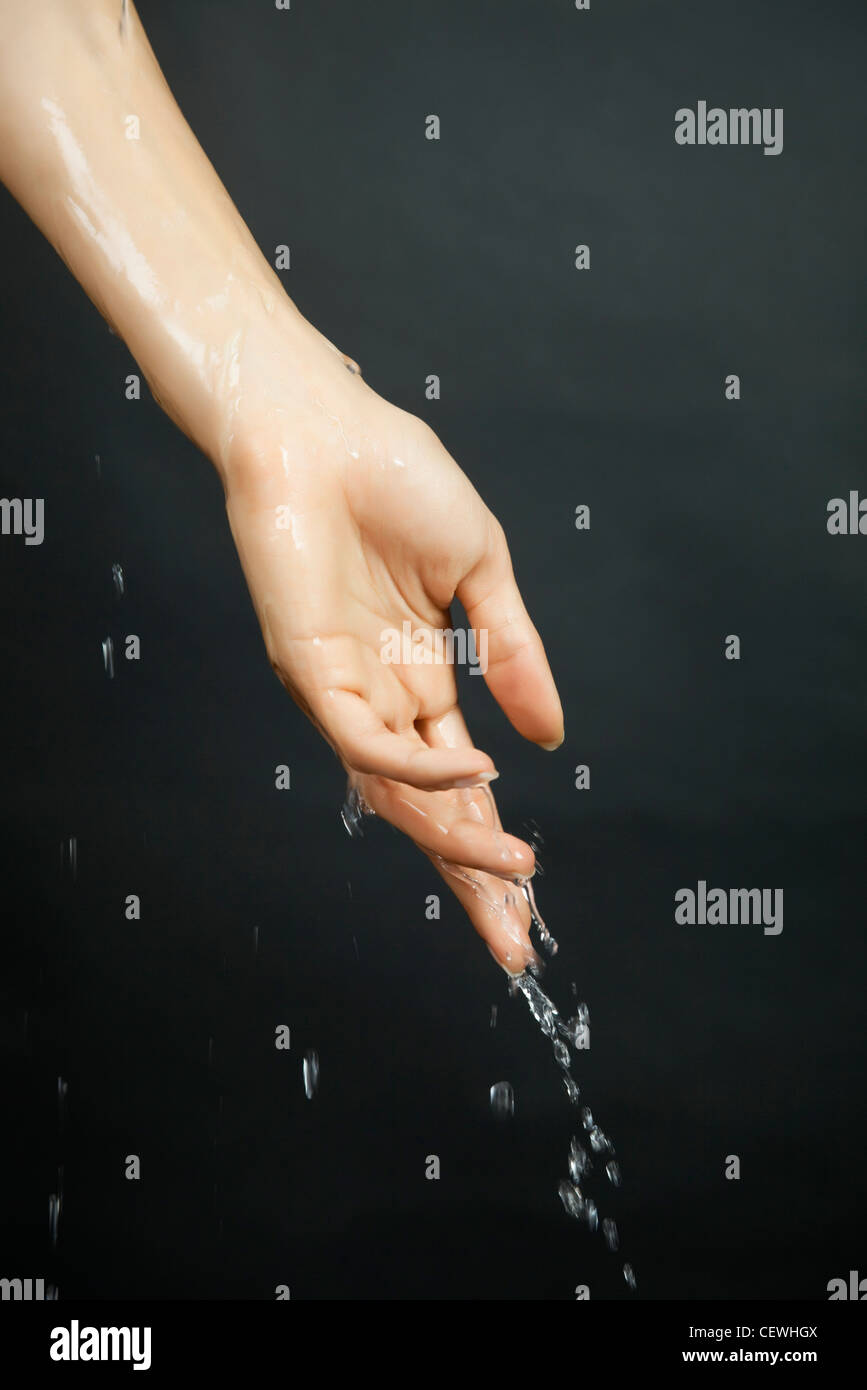 Hand under running water Stock Photo - Alamy