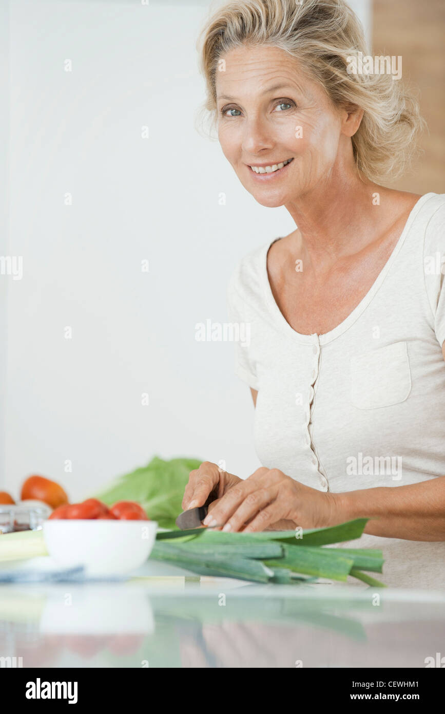 Mature woman preparing healthy food, portrait Stock Photo - Alamy
