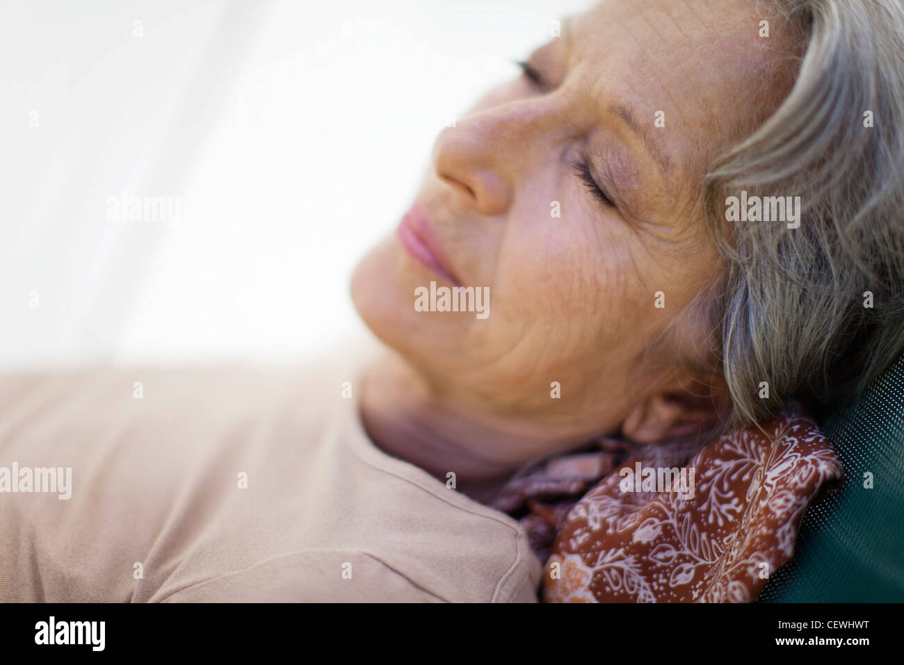 Senior woman napping Stock Photo - Alamy