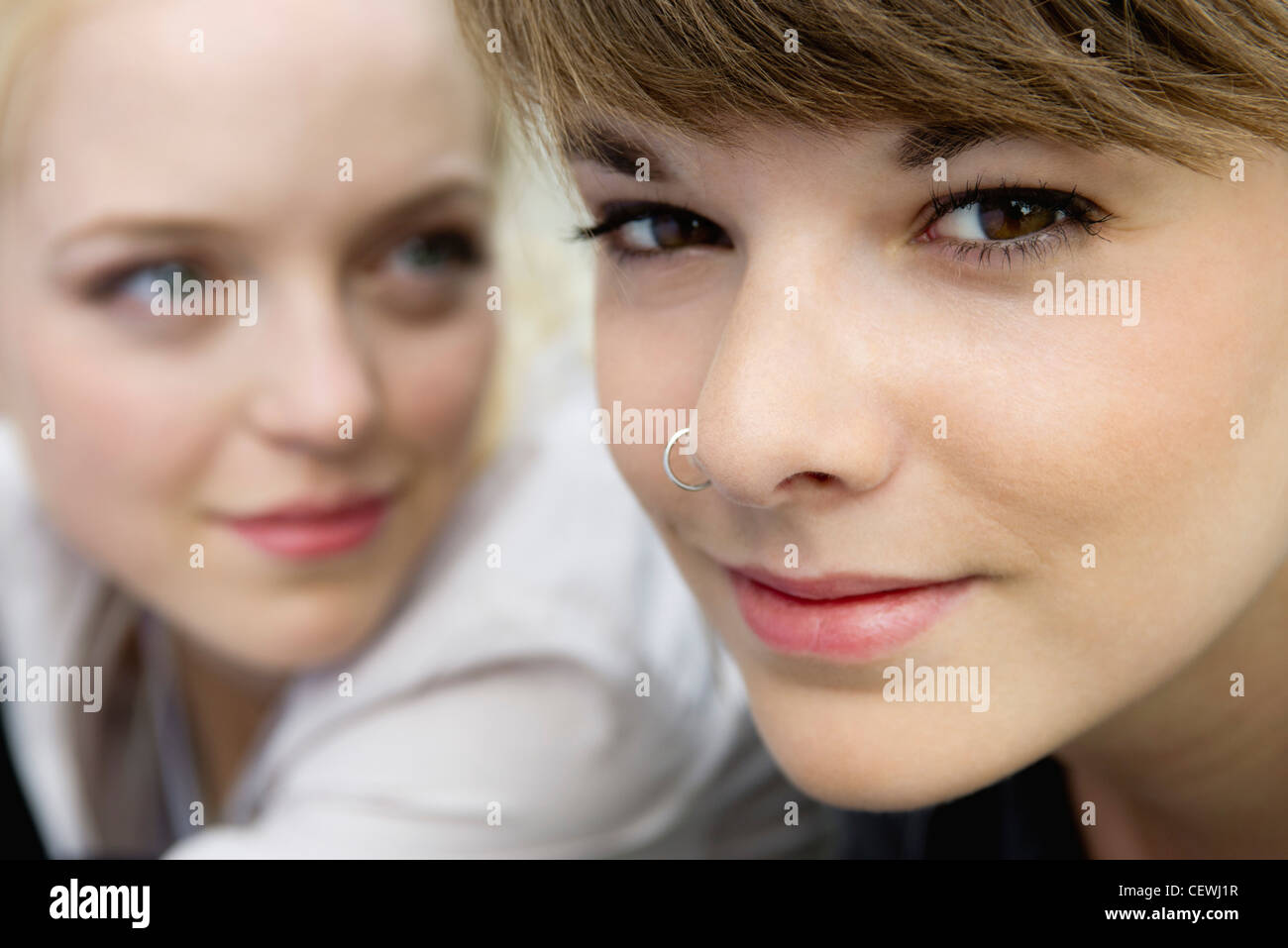 Young woman with friend, smiling, portrait Stock Photo - Alamy