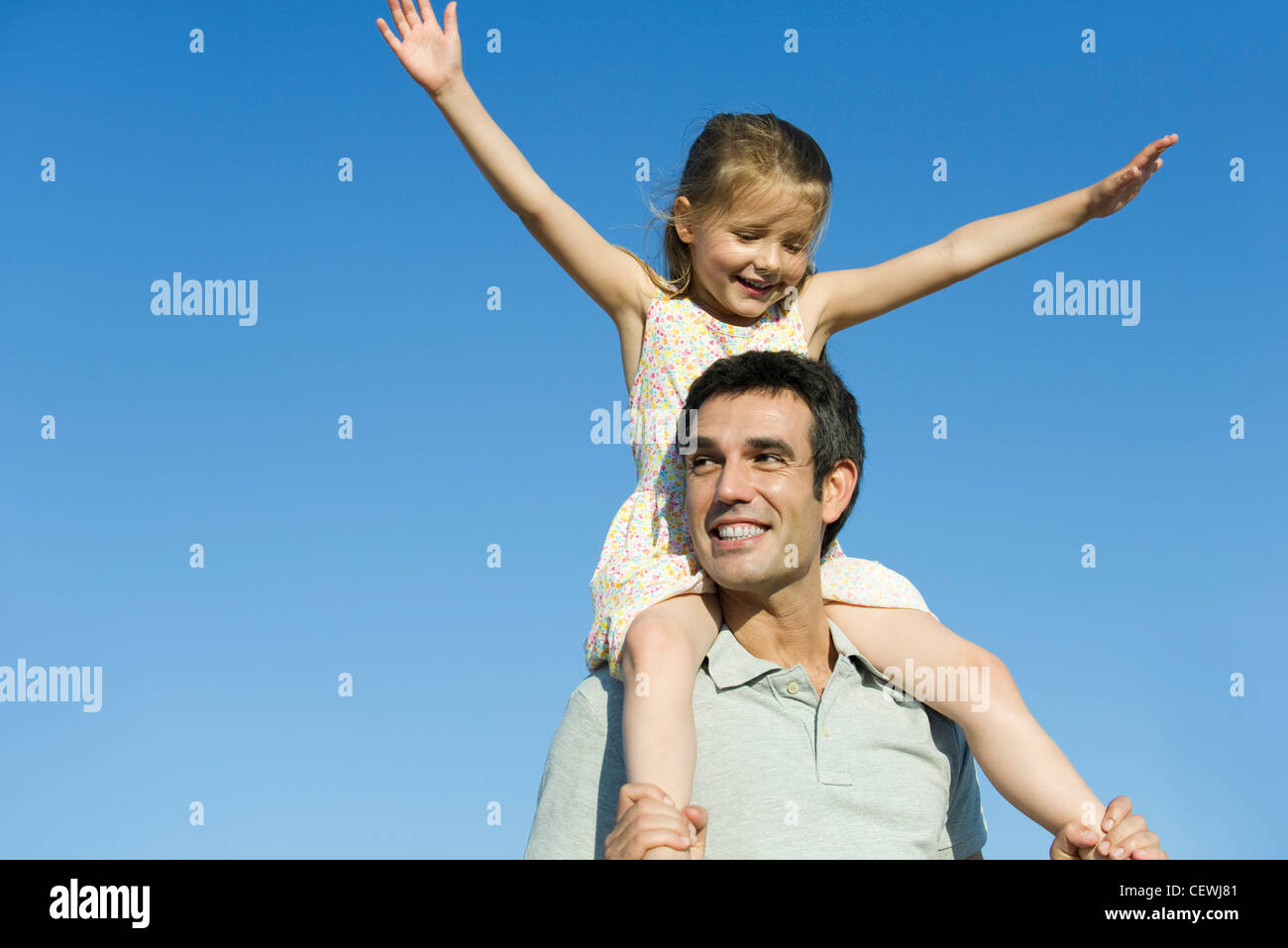 Father carrying daughter on his shoulders Stock Photo - Alamy