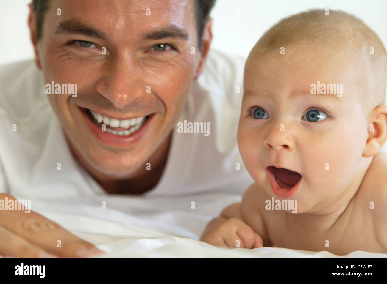 Father and baby laughing together, portrait Stock Photo - Alamy