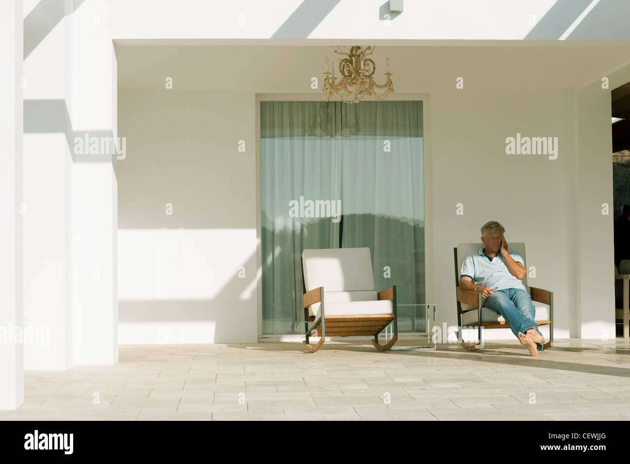 Man Sitting On Rocking Chair High Resolution Stock Photography and ...