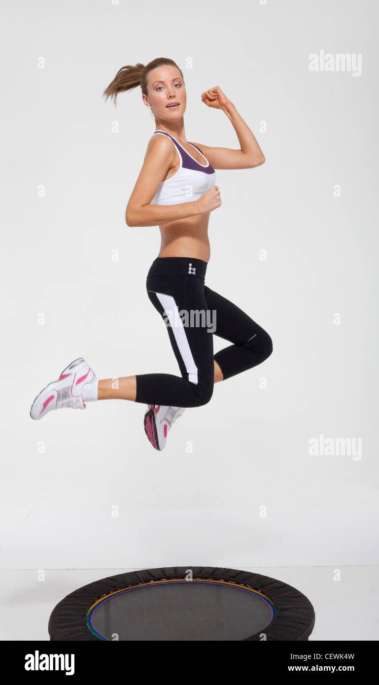 Female fair hair tied into ponytail, wearing a cropped vest, black ...
