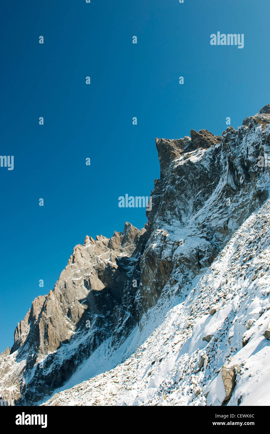 Steep mountains covered in snow Stock Photo - Alamy