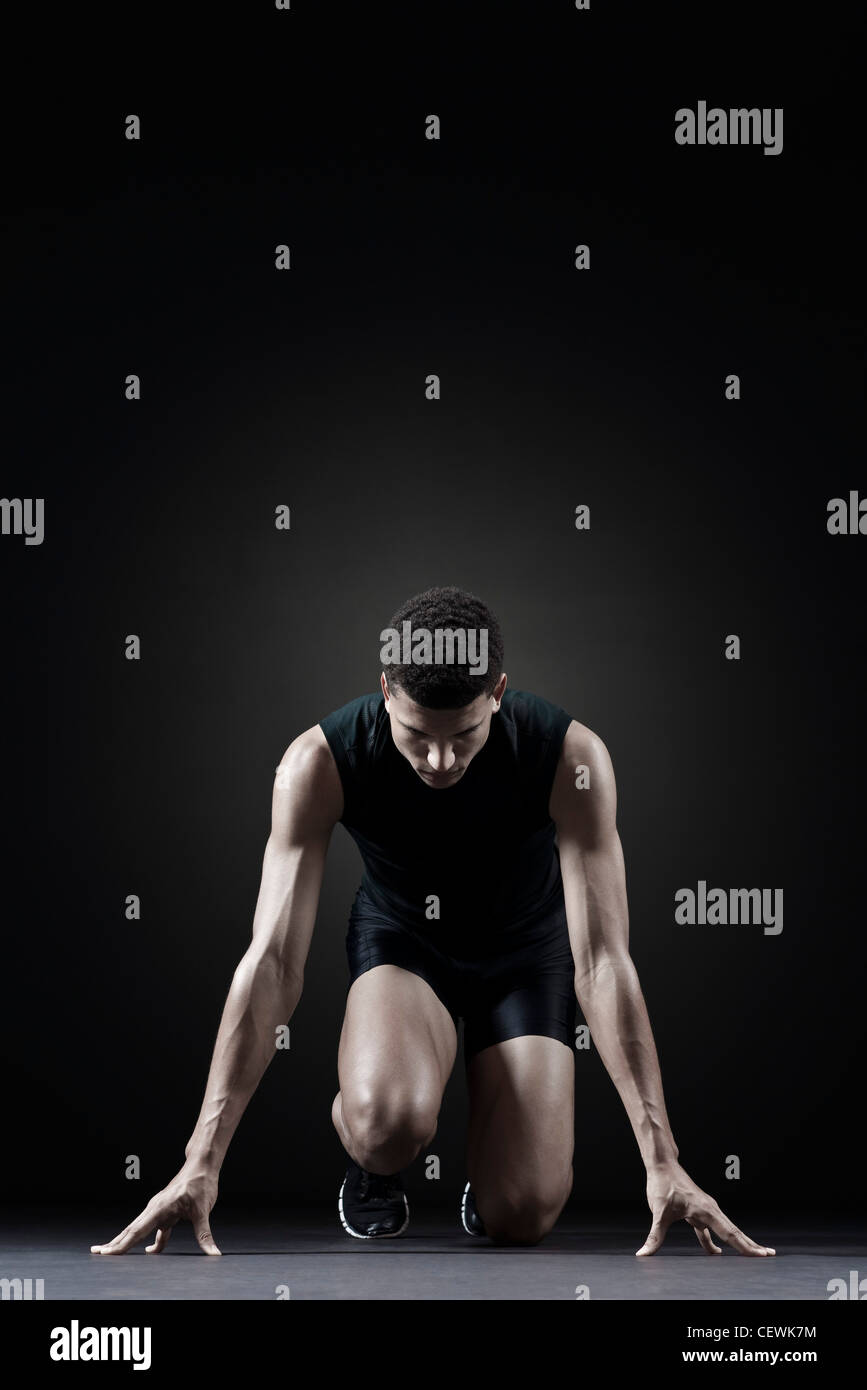 Runner at starting line Stock Photo - Alamy