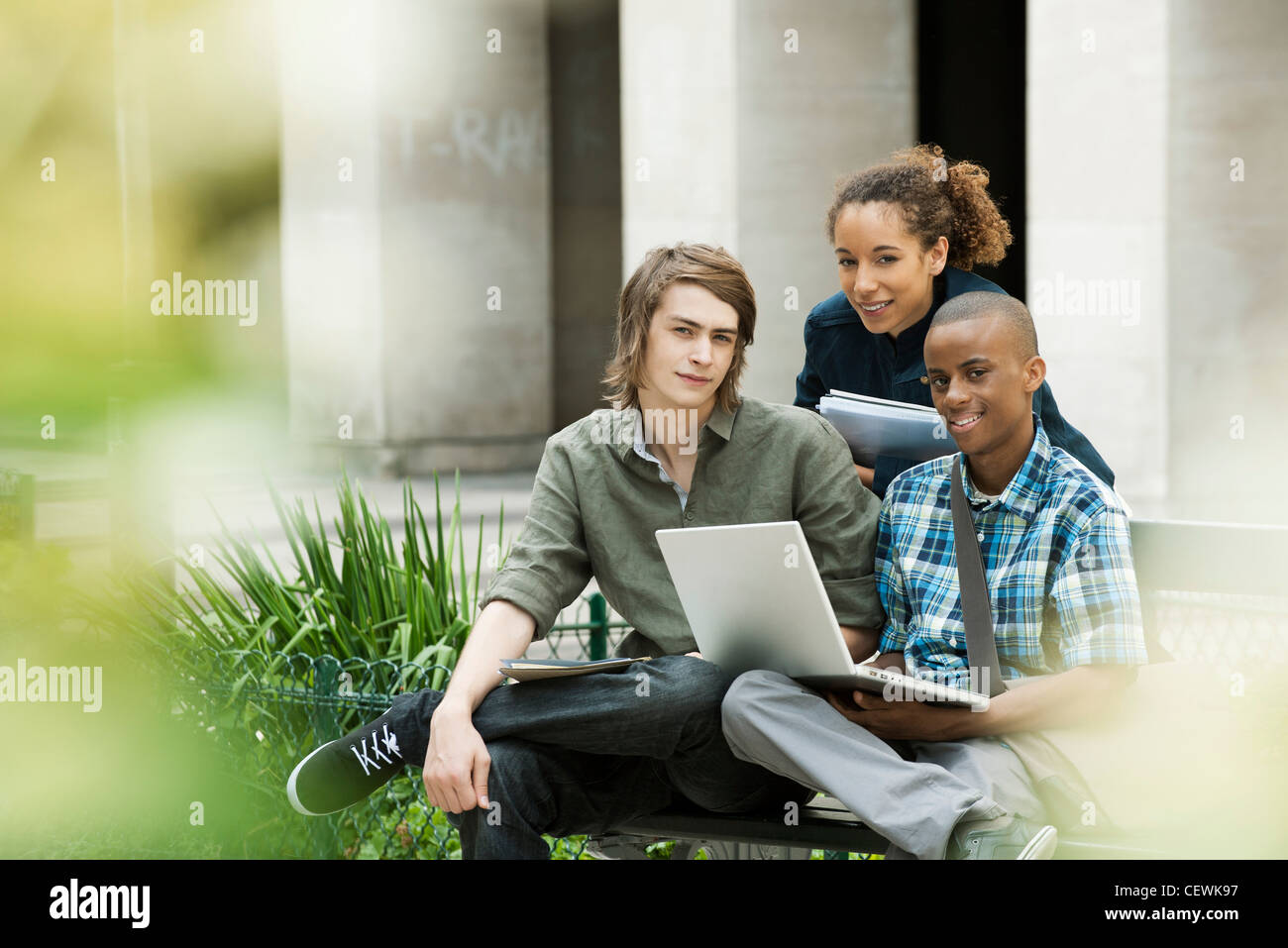 University students on campus with laptop computer Stock Photo - Alamy