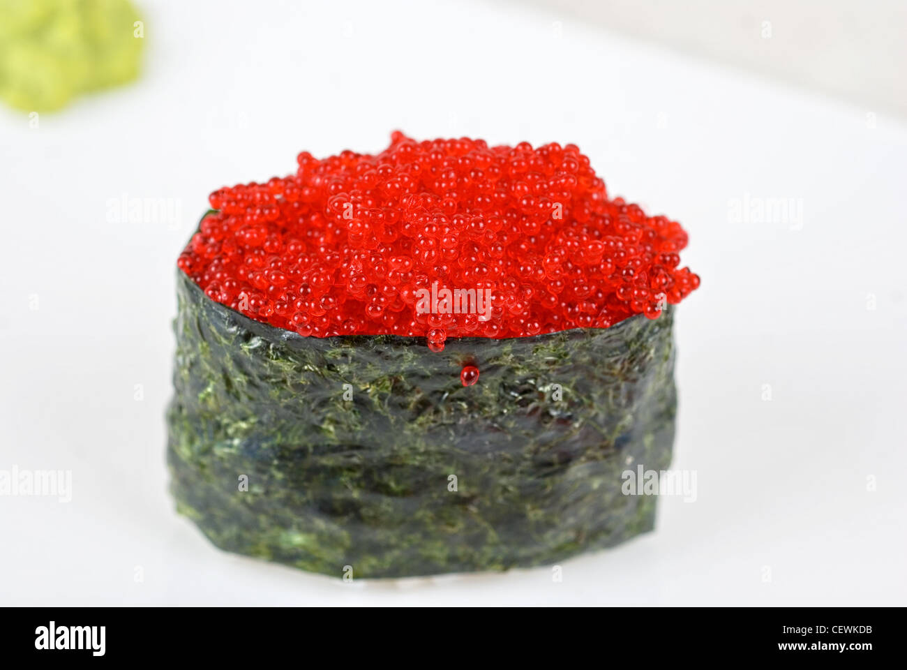Red tobiko (flying fish roe) sushi closeup Stock Photo - Alamy