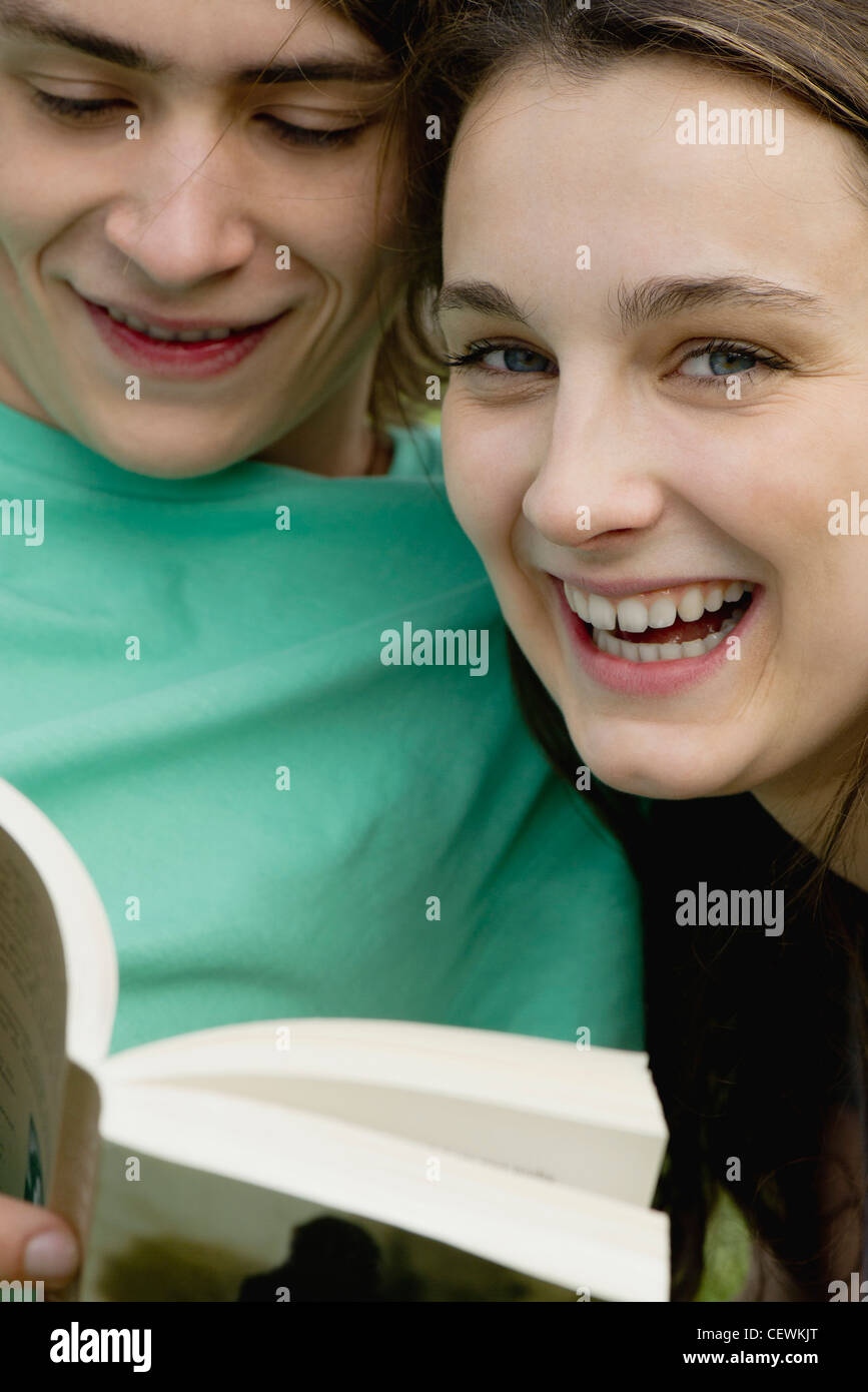 Young couple reading book together, portrait Stock Photo - Alamy
