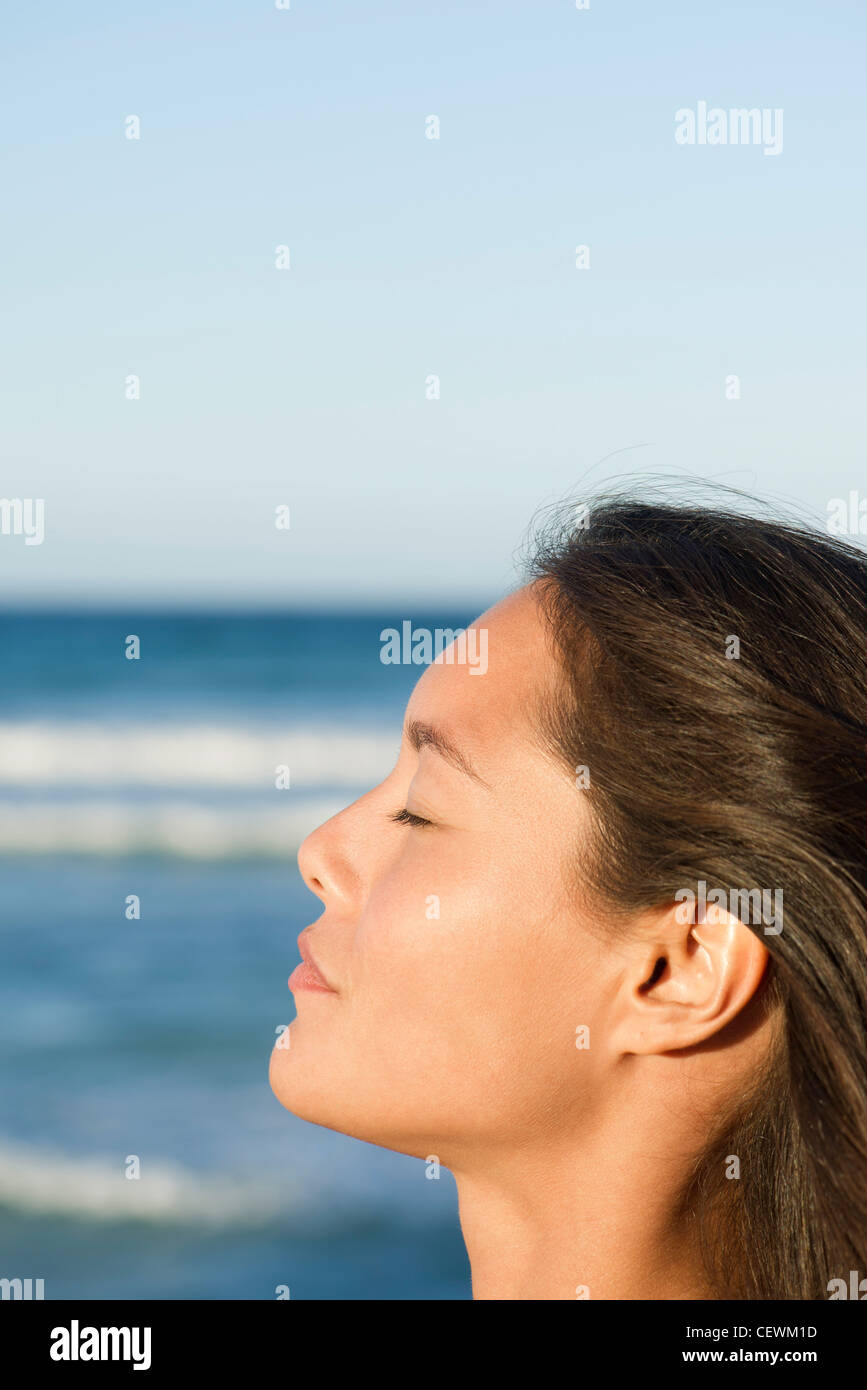 Young woman relaxing with eyes closed, profile Stock Photo - Alamy