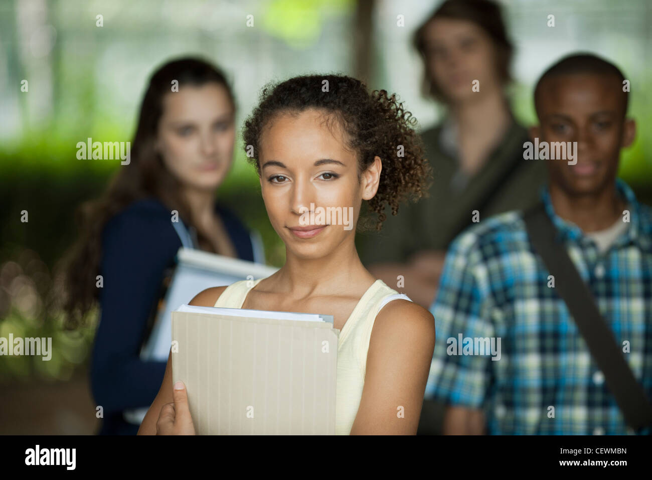 Female university student, friends in background Stock Photo - Alamy