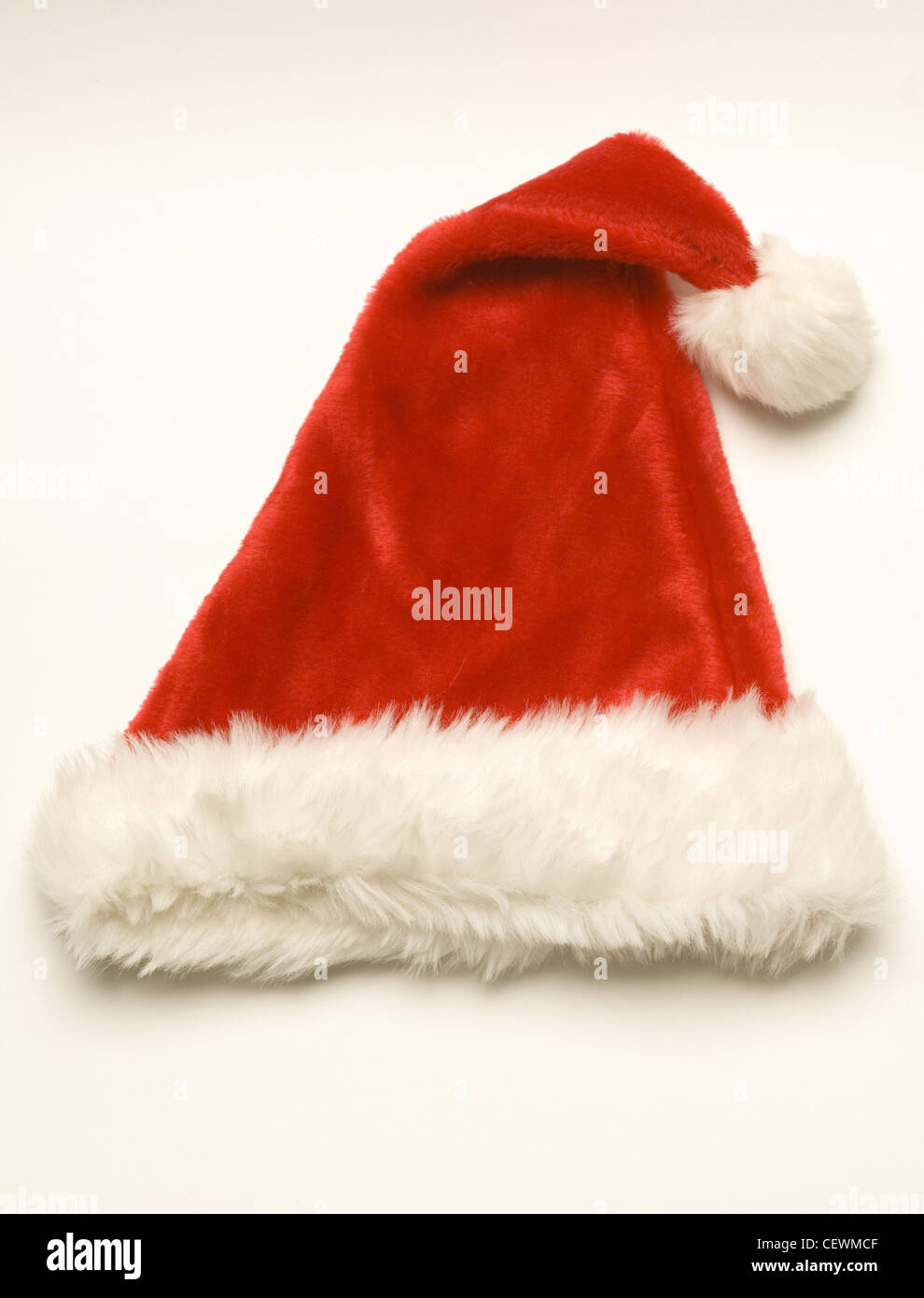 Red Santa Claus hat, photographed against white background Stock Photo ...