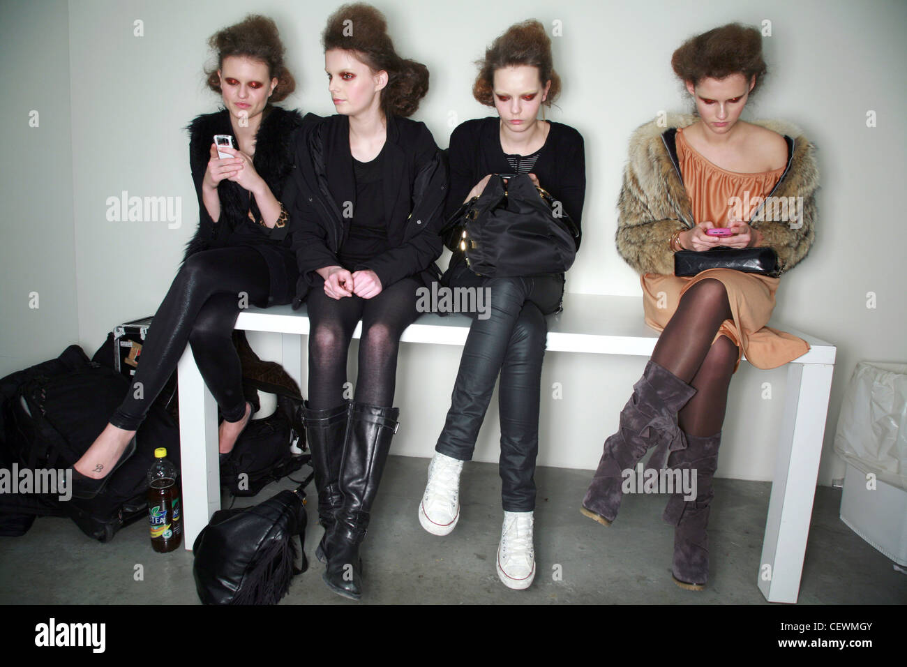 Prada Backstage Milan Ready to Wear Autumn Winter Four models wearing ...