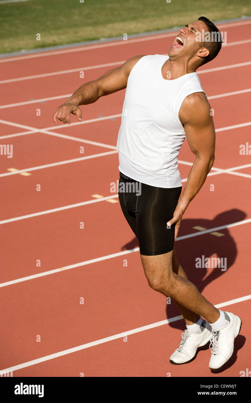 Runner on running track painful hi-res stock photography and images - Alamy