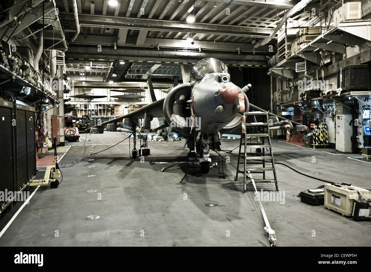 Harrier jet in naval aircraft carrier HMS Illustrius Stock Photo - Alamy
