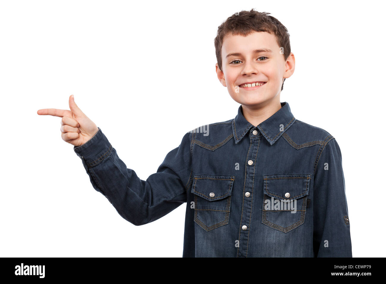 Boy pointing to the side of the image, isolated on white background ...
