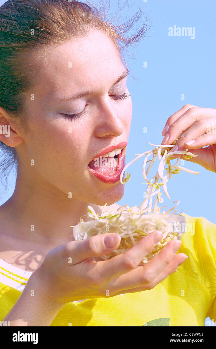 Woman eating from a bowl outdoors hi-res stock photography and images ...