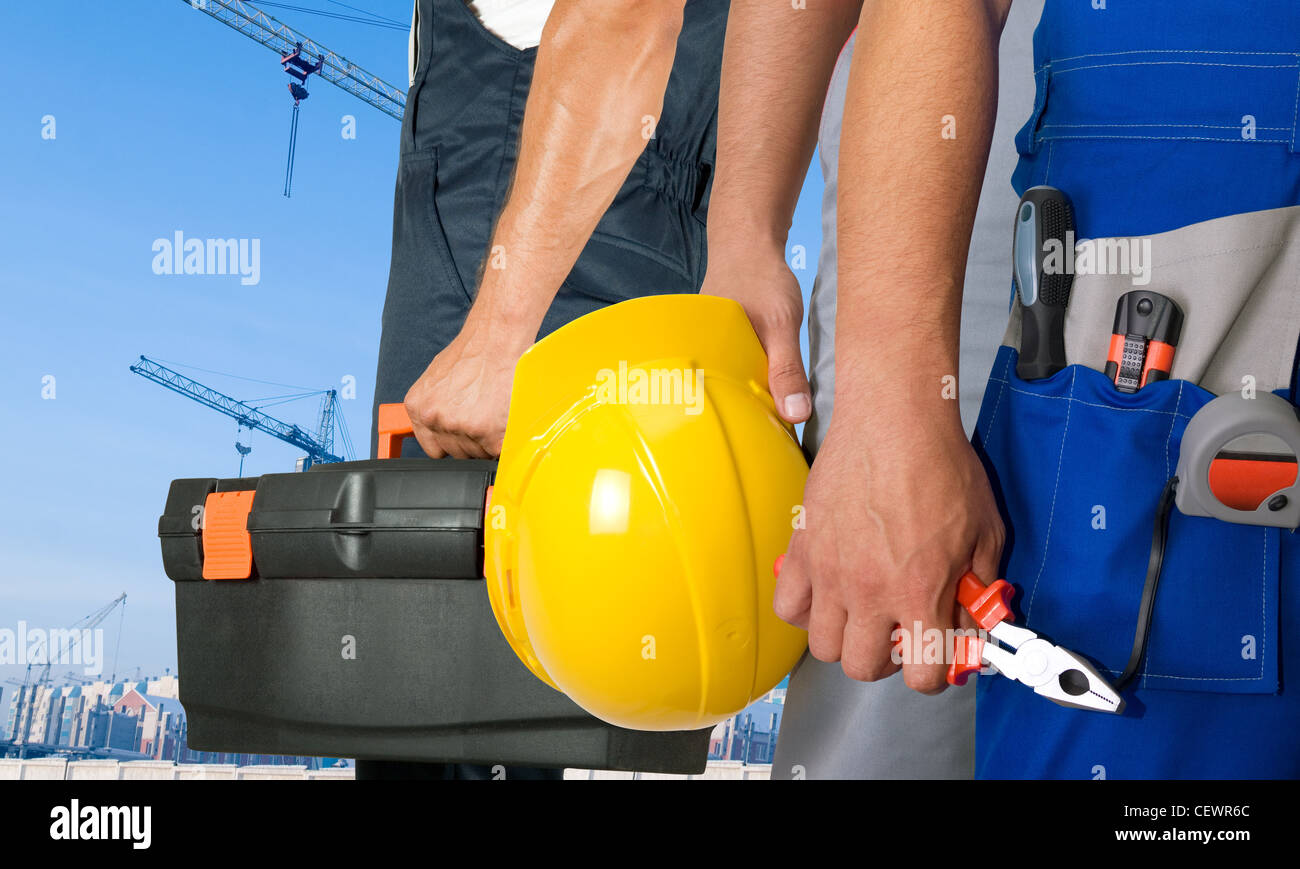 Different workers man closeup on building background Stock Photo - Alamy