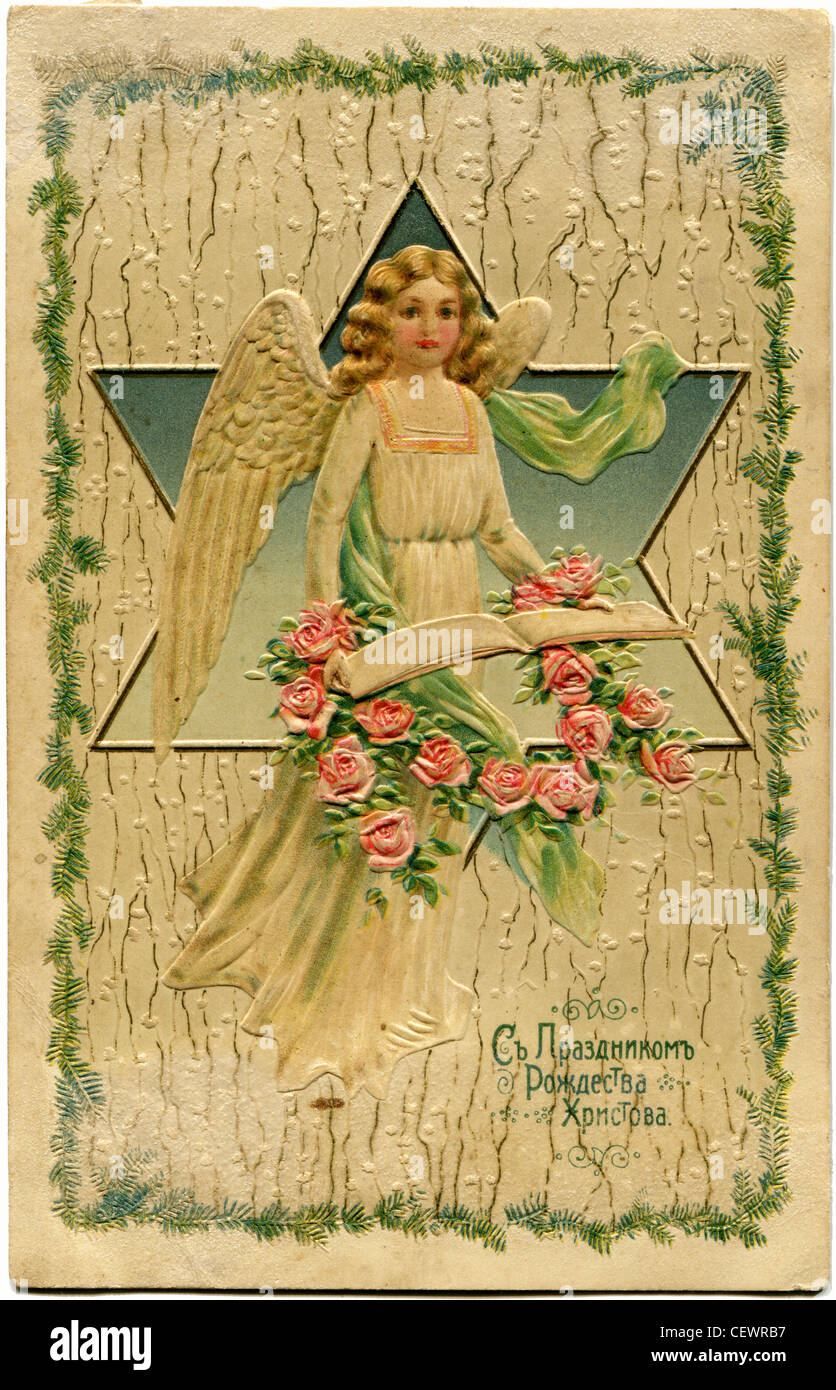 angel holding a wreath of roses Stock Photo - Alamy