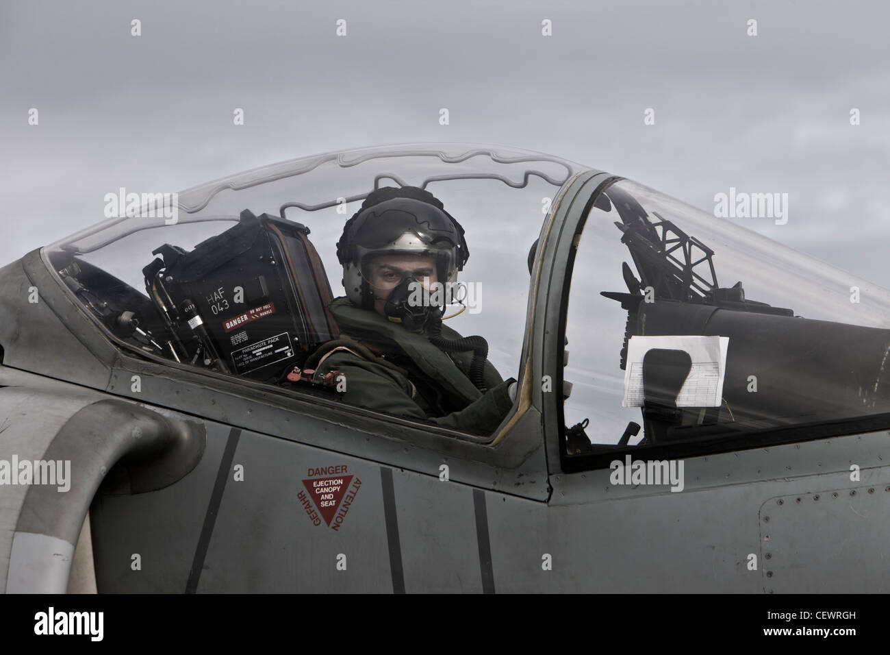 Pilot boarding harrier jet on naval aircraft carrier HMS Illustrius ...