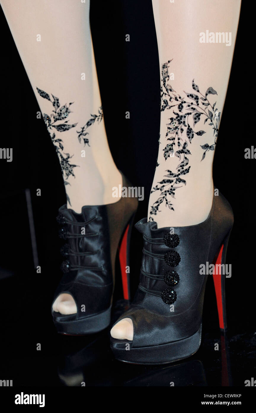 Cropped image of model wearing tights with embellished leaf print and ...