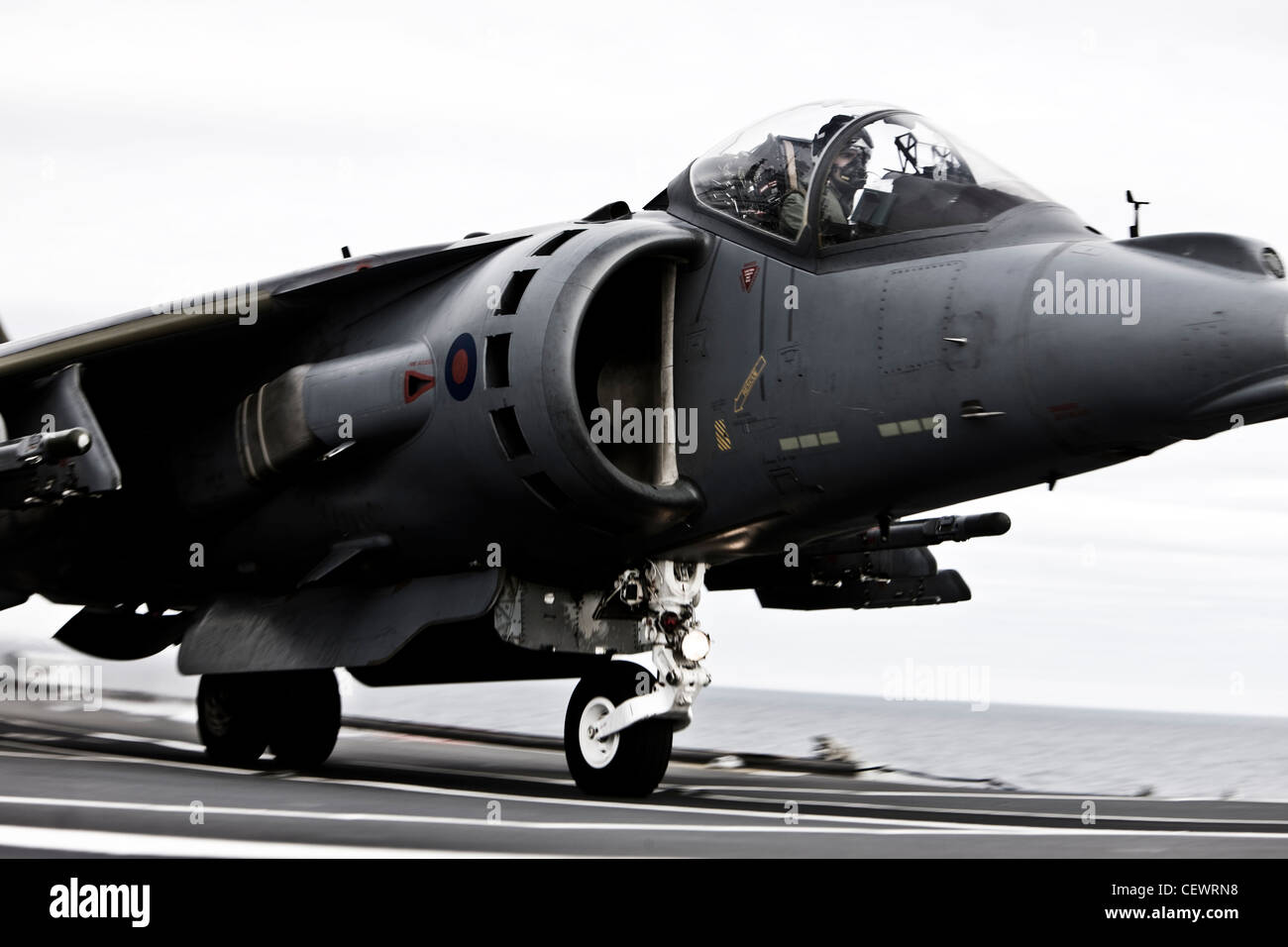 Pilot in harrier jet on naval aircraft carrier HMS Illustrius Stock ...