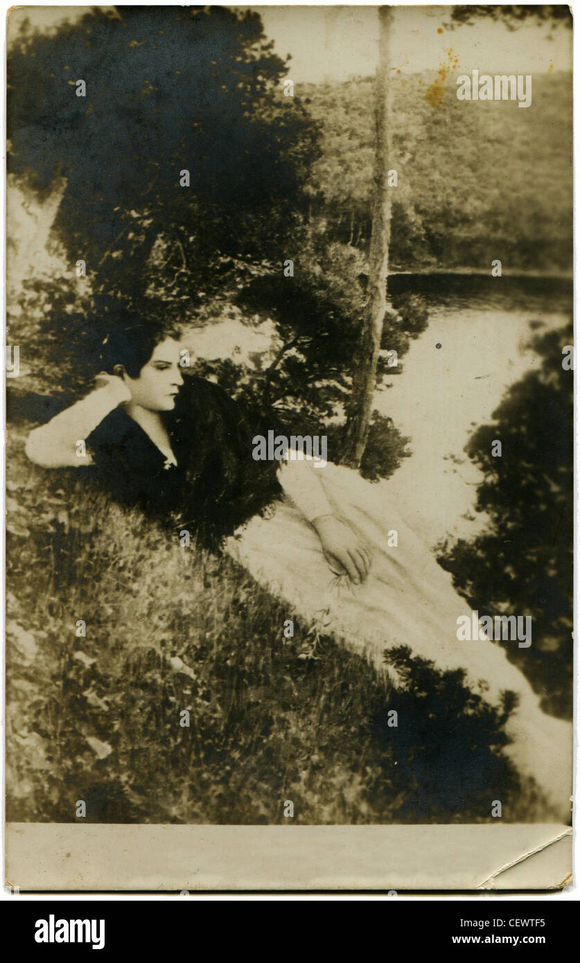 RUSSIA - CIRCA 1913: Reproduction of antique postcard shows sad woman ...