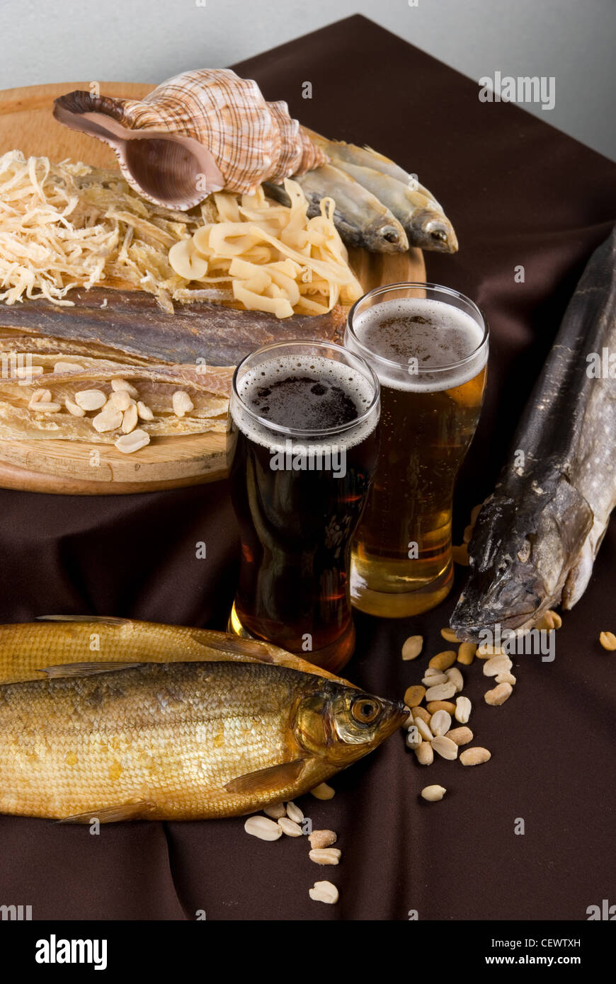 Beer and snacks set: chips, pistachio, shrimp and fish Stock Photo - Alamy