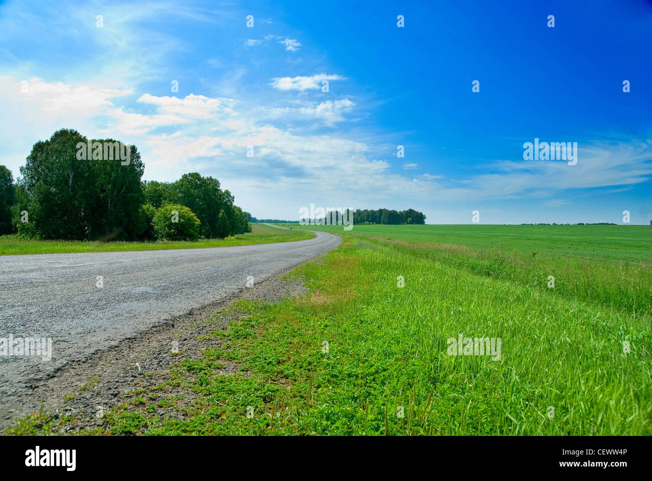Picture of empty countryside road Stock Photo - Alamy