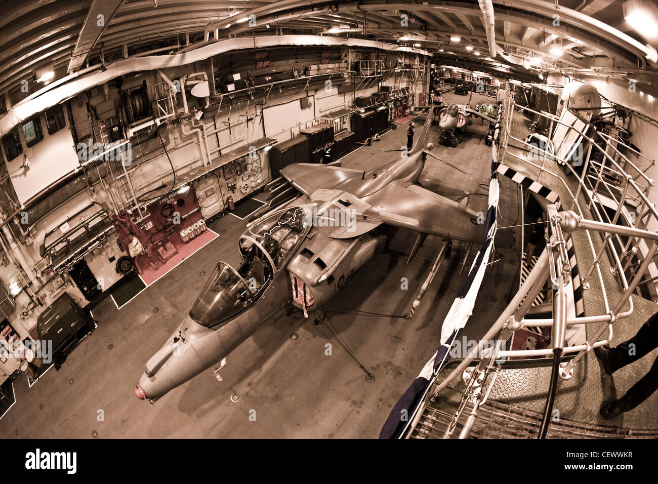 Harrier jet in naval aircraft carrier HMS Illustrius Stock Photo - Alamy