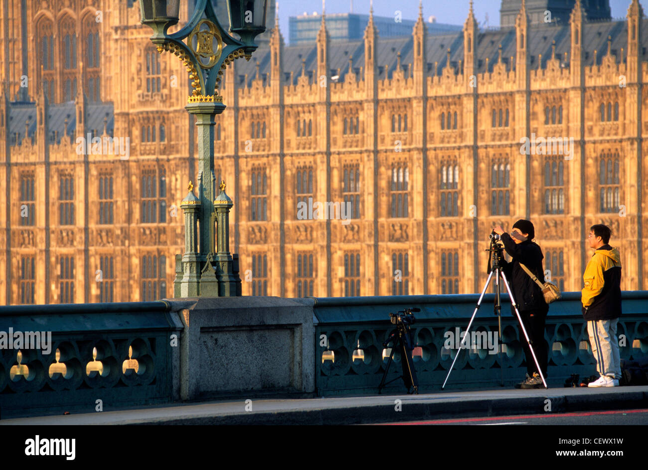 Two early tourists snapping on Westminster Bridge Stock Photo - Alamy