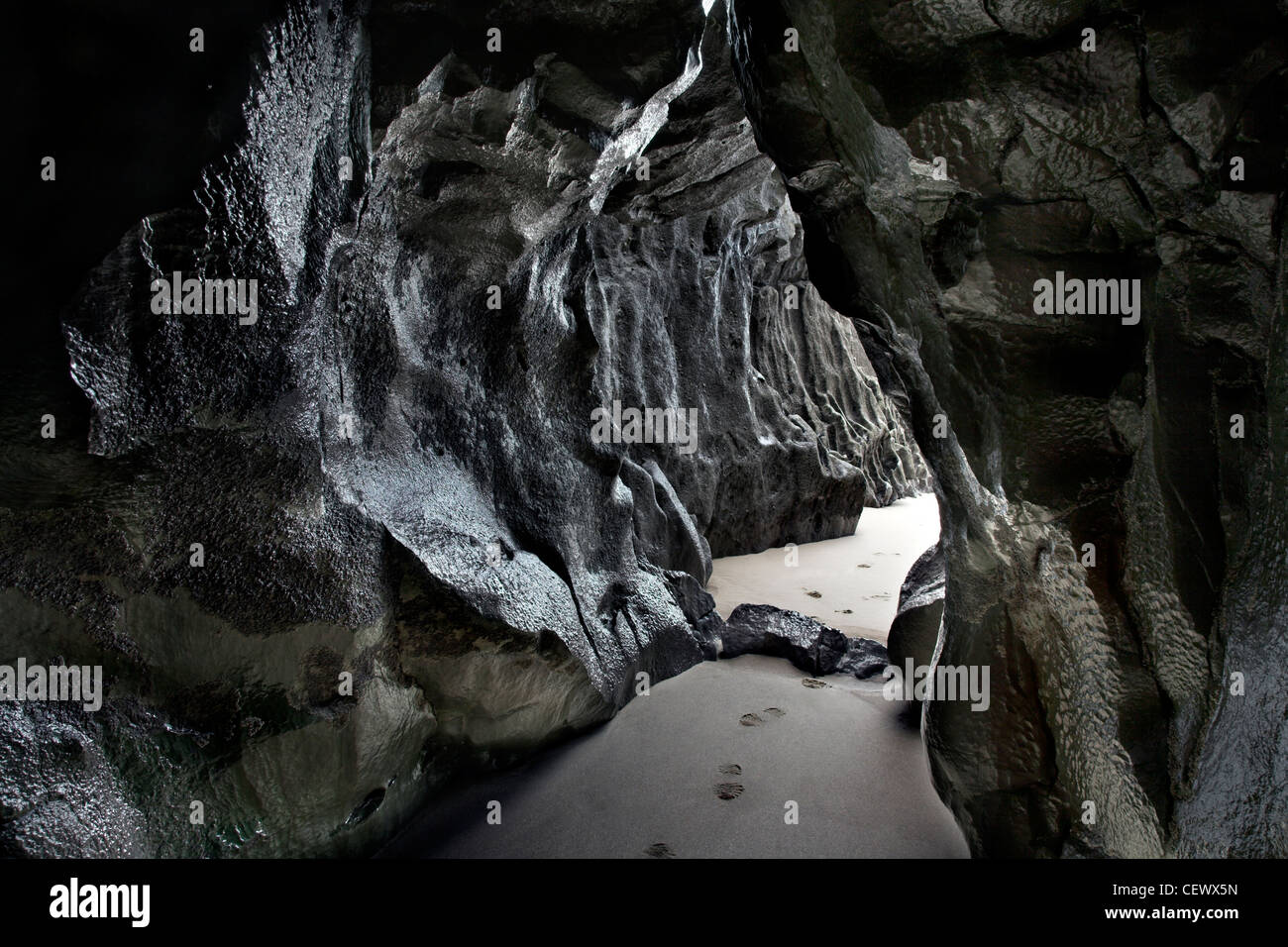 Interior of a cave formed in eroded limestone on the Gower peninsula ...
