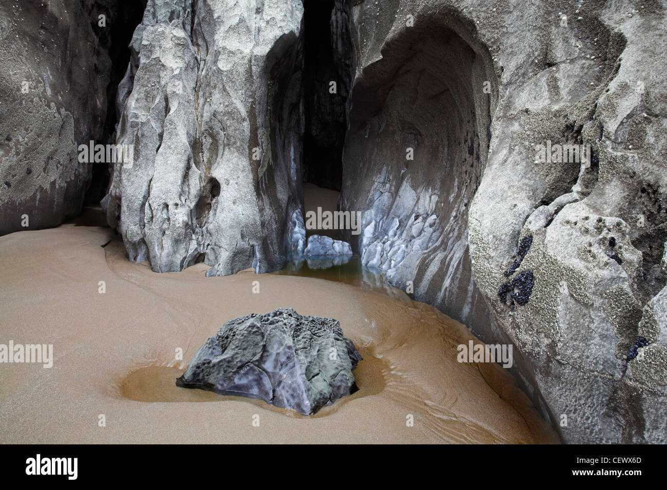 Interior of a cave formed in eroded limestone on the Gower peninsula ...