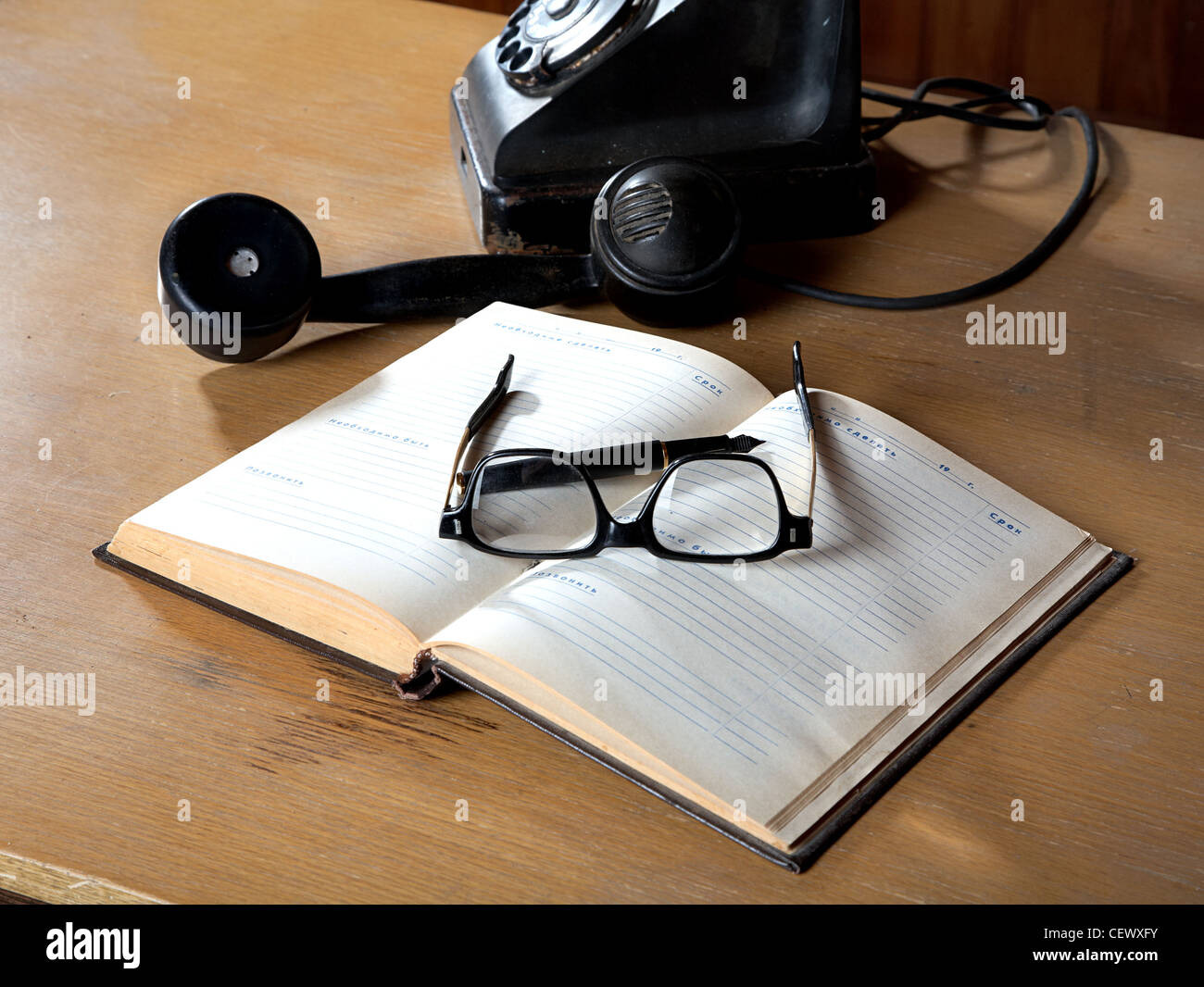 The old daily log with glasses and phone on a table Stock Photo - Alamy