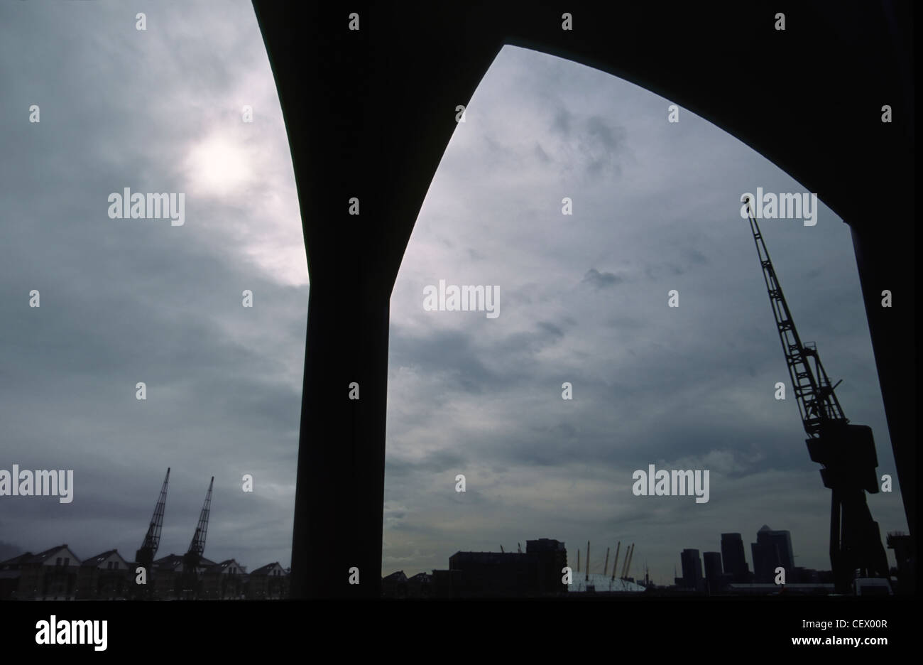 Cranes and the Greenwich O2 Dome in silhouette, London Stock Photo - Alamy