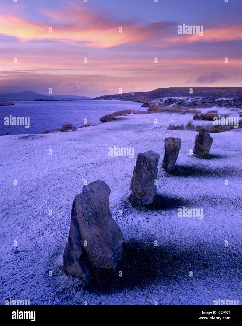 Lake and standing stones on a snow covered mountain top Stock Photo - Alamy