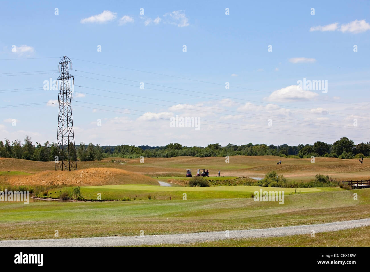 Golf course and electric wires in England Stock Photo - Alamy