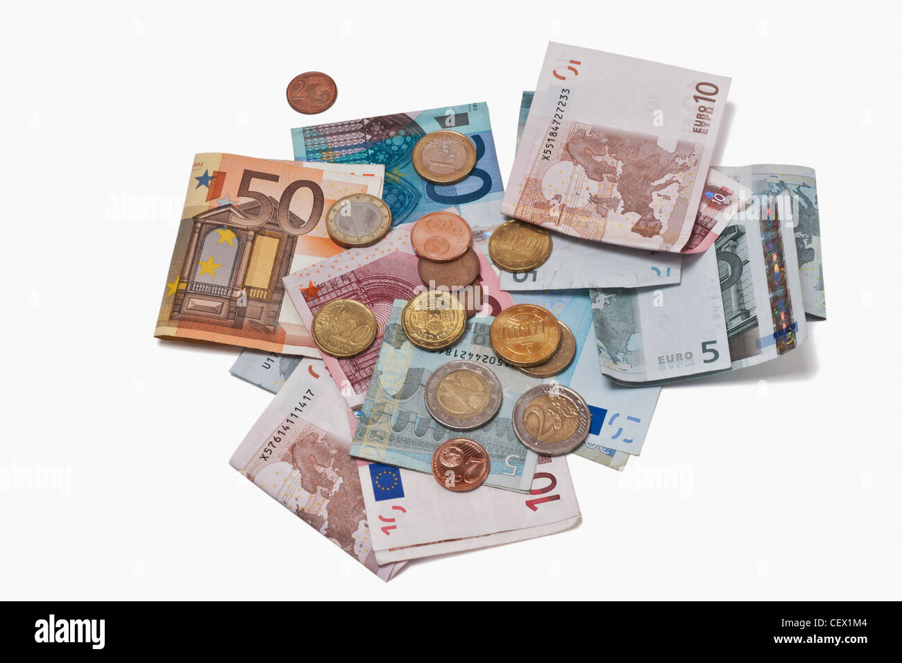 Many Euro bills and Euro Coins lying side by side. On January 01st 2002 ...