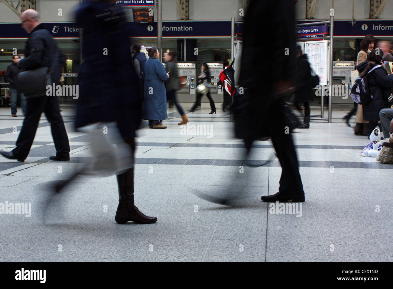 Busy commuters rush through a train station Stock Photo - Alamy